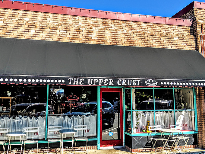 The charming storefront beckons like a siren song for pie lovers. That black awning and teal trim practically whisper, "Yes, happiness lives here."