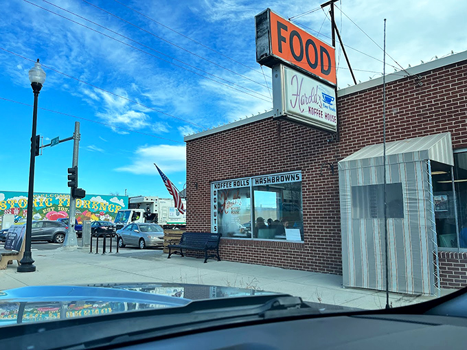 That orange "FOOD" sign might be the most honest advertising in America. No frills, just promises kept at Harold's Koffee House. 