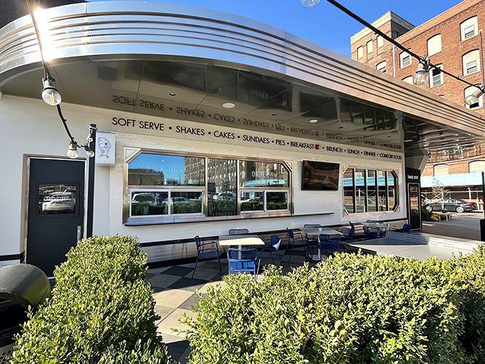 The gleaming Art Deco exterior of Tops Diner stands like a chrome-plated time machine, promising comfort food that transcends eras. New Jersey's diner royalty awaits.