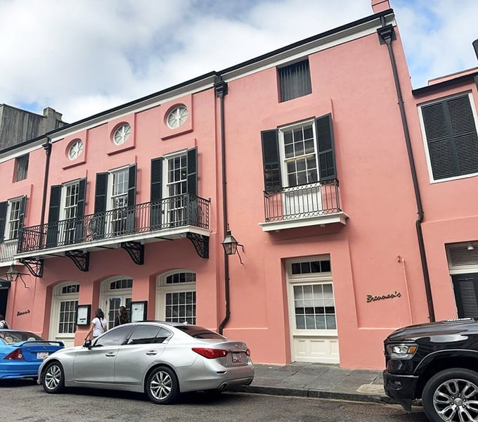 The pink façade of Brennan's stands out on Royal Street like a sophisticated Southern belle who knows she's turning heads—and doesn't mind one bit. 