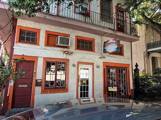 Surrey's pink façade stands like a breakfast beacon on Magazine Street, where New Orleans mornings transform from ordinary to extraordinary behind those cheerful windows. 