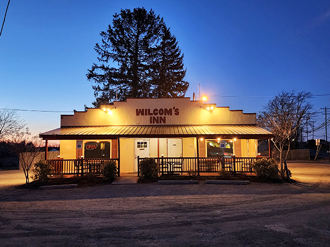 The unassuming exterior of Wilcom's Inn stands as a culinary speakeasy—proof that the best flavors often hide behind the simplest facades.