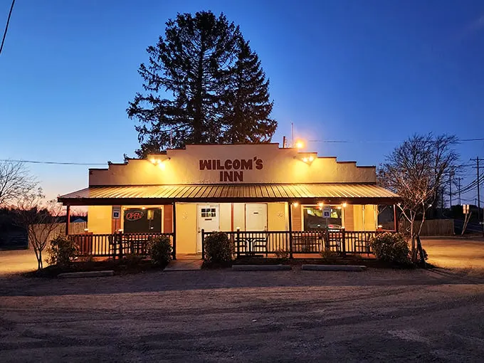 The unassuming exterior of Wilcom's Inn stands as a culinary speakeasy—proof that the best flavors often hide behind the simplest facades.