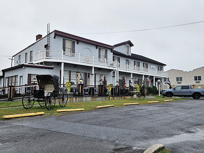 Colonial charm meets Maryland hospitality at the Carriage House Inn's pristine exterior, where that American flag isn't just decoration—it's a promise of classic American cuisine inside.