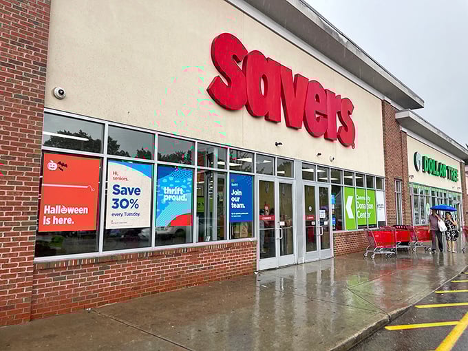 The iconic red Savers sign beckons like a lighthouse for bargain hunters, promising treasures waiting just beyond those sliding glass doors. 