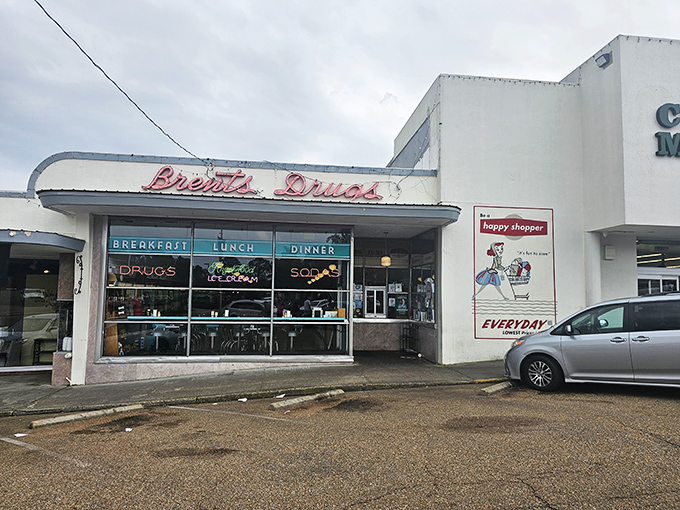 The classic storefront of Brent's Drugs beckons with its vintage neon sign, promising a taste of Mississippi nostalgia alongside your breakfast.