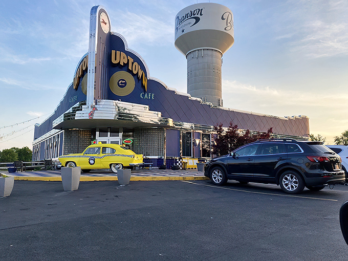 The neon-drenched Art Deco façade of Jackie B. Goode's glows like a beacon for hungry time travelers, complete with that perfect vintage yellow cab parked outside.