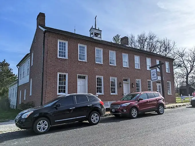 The historic red brick exterior of J. Huston Tavern stands proudly since 1834, making it the oldest continuously operating restaurant west of the Mississippi.