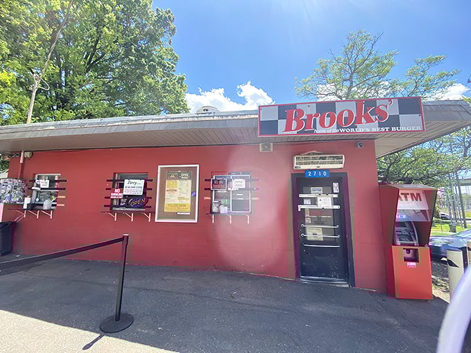 The humble red cinderblock building houses Charlotte's burger royalty—a no-frills temple to flat-top perfection since 1973. 