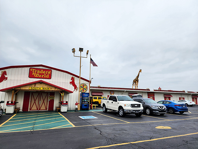 The iconic red and white entrance to Traders World beckons with its horse silhouettes and American flags—like the pearly gates of bargain heaven.