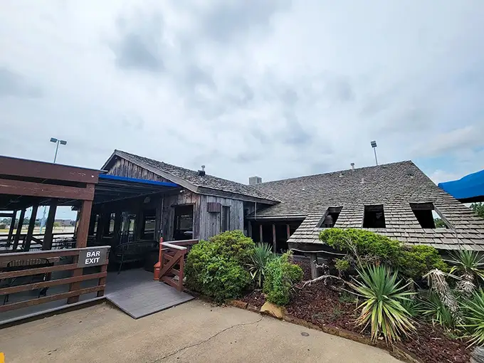 The weathered wooden exterior of Pelican's isn't putting on airs—it's saving all the drama for what's on your plate.