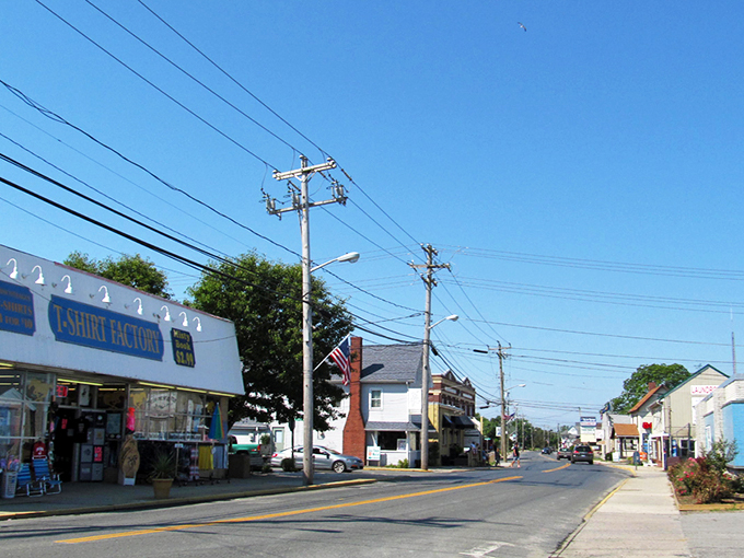 Chincoteague's Main Street feels like stepping into a Norman Rockwell painting where seafood replaces apple pie as the local currency.
