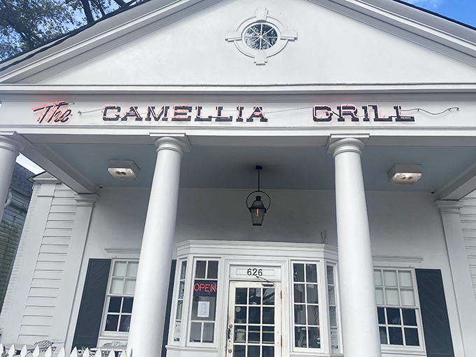 The Greek revival façade of Camellia Grill stands like a culinary Parthenon, welcoming hungry pilgrims to this temple of comfort food since 1946.