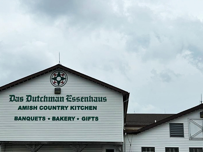The iconic white facade of Das Dutchman Essenhaus stands proudly against the Indiana sky, promising comfort food that'll make your cardiologist wince and your soul sing.