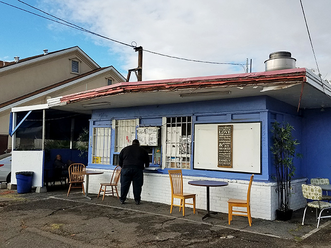 The unassuming blue exterior of Tori's Place stands like a culinary speakeasy – no fancy frills, just the promise of soul-satisfying greatness within.