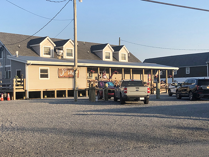 The quintessential coastal charm of JP's on the Wharf beckons with its weathered deck and Cape Cod-style architecture—seafood paradise found!