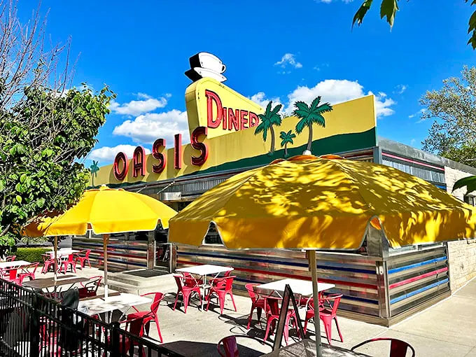 The classic stainless steel and stone exterior of The Oasis Diner stands like a time capsule on Plainfield's landscape, its iconic yellow sign beckoning hungry travelers.
