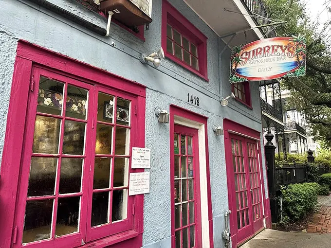 Surrey's pink façade stands like a breakfast beacon on Magazine Street, where New Orleans mornings transform from ordinary to extraordinary behind those cheerful windows.