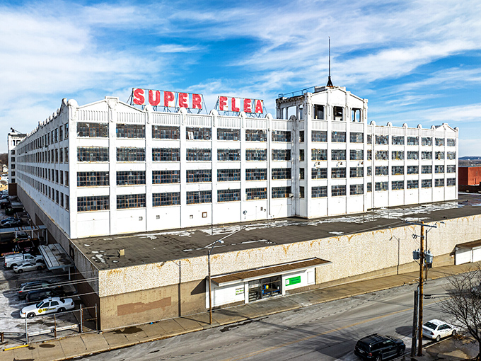 The imposing white fortress of Super Flea stands against a brilliant blue Missouri sky – a siren call to bargain hunters and collectors alike.