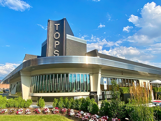 The gleaming Art Deco exterior of Tops Diner stands like a chrome-plated time machine, promising comfort food that transcends eras. New Jersey's diner royalty awaits.