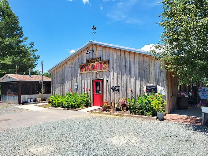 The rustic wooden exterior with that bright red door is like a beacon for barbecue pilgrims. Simplicity never looked so appetizing.