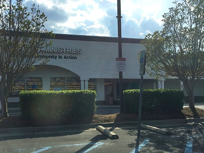 The welcoming façade of Dorcas Ministries invites treasure hunters with its clean white exterior and clear signage about donation procedures and store hours.