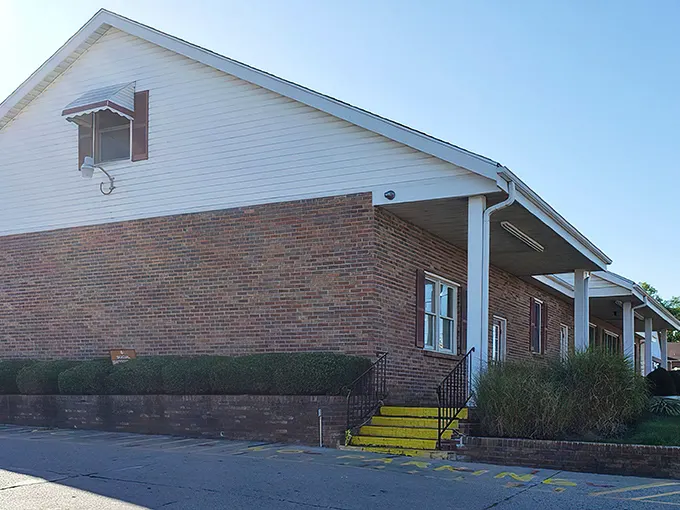 The unassuming brick exterior of Bill's Donut Shop hides a wonderland of fried dough treasures that locals have cherished for decades.
