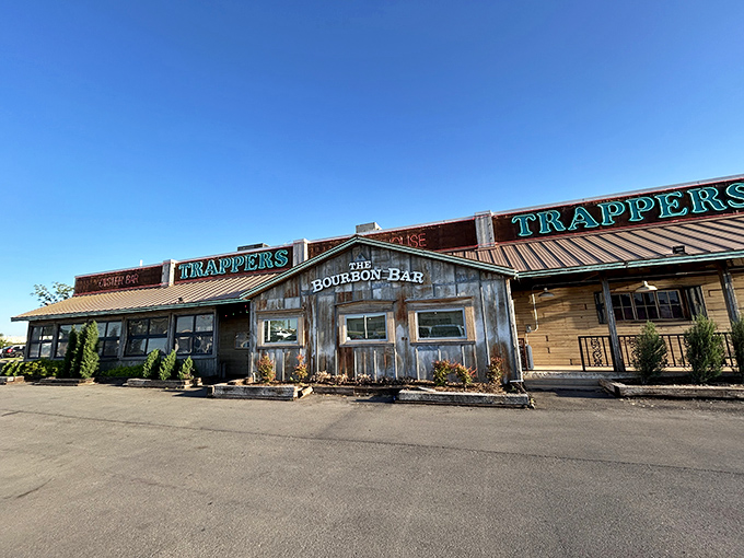 The weathered wooden exterior of Trapper's Fishcamp & Grill looks like it was teleported straight from a Louisiana bayou to Oklahoma City. Pure rustic charm!