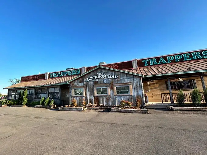 The weathered wooden exterior of Trapper's Fishcamp & Grill looks like it was teleported straight from a Louisiana bayou to Oklahoma City. Pure rustic charm!