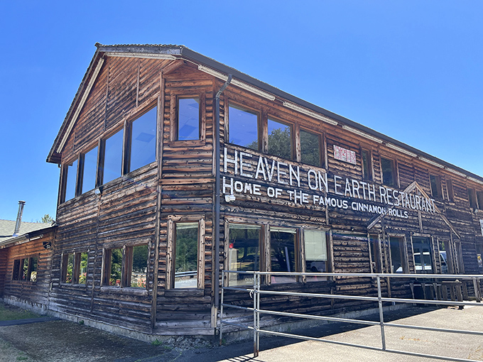 The rustic log cabin exterior of Heaven on Earth Restaurant stands as a beacon for hungry travelers on I-5, promising comfort food salvation in Azalea.