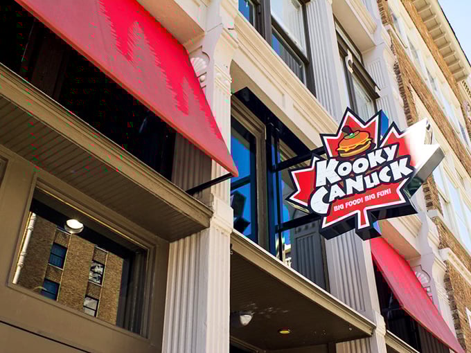 The iconic maple leaf sign beckons hungry adventurers to Kooky Canuck, where Canadian charm meets Memphis hospitality on downtown's bustling streets.