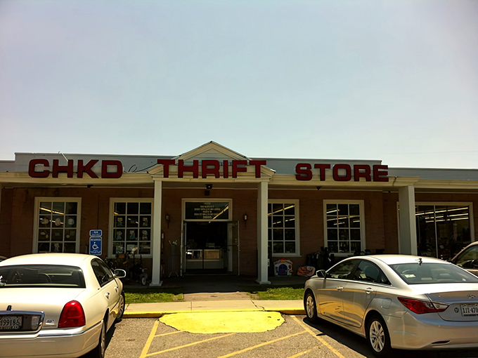 The brick facade of CHKD Thrift Store welcomes bargain hunters with a colorful array of children's toys spilling onto the sidewalk—a preview of treasures awaiting inside.