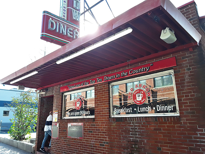 That iconic neon sign isn't just advertising – it's a beacon of hope for the breakfast-deprived masses of Manchester since 1922.