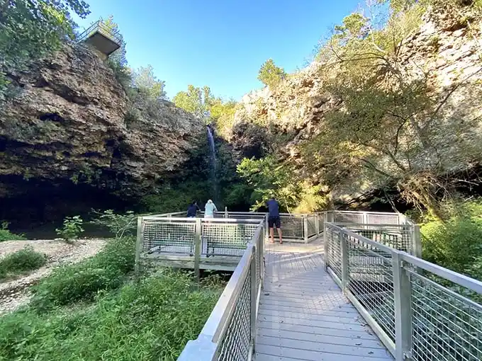 The spectacular 77-foot waterfall plunges through limestone cliffs at Natural Falls, creating an enchanting scene that feels more Pacific Northwest than Oklahoma.