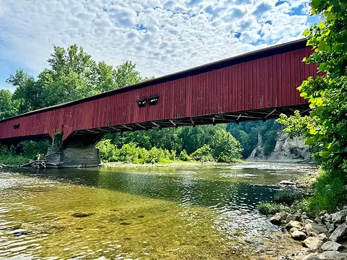 This historic covered bridge spans Sugar Creek, offering another glimpse of Indiana's timeless beauty that complements your wilderness adventure perfectly.