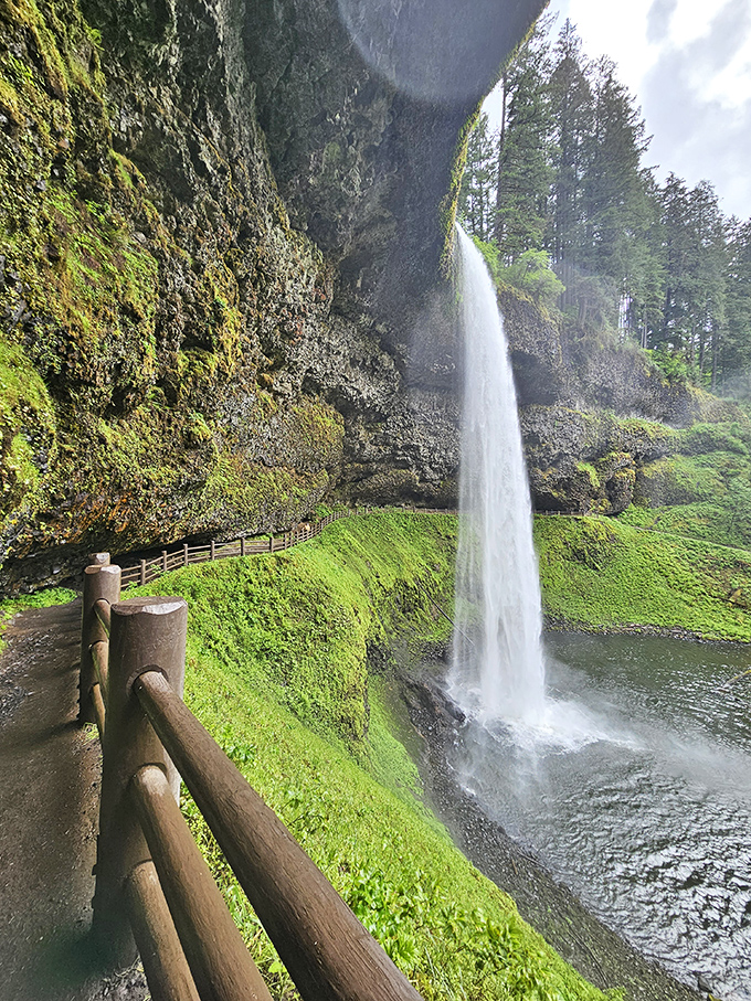 Walking behind South Falls feels like stepping into nature's backstage pass – where the thundering curtain of water creates its own microclimate of mist and wonder.
