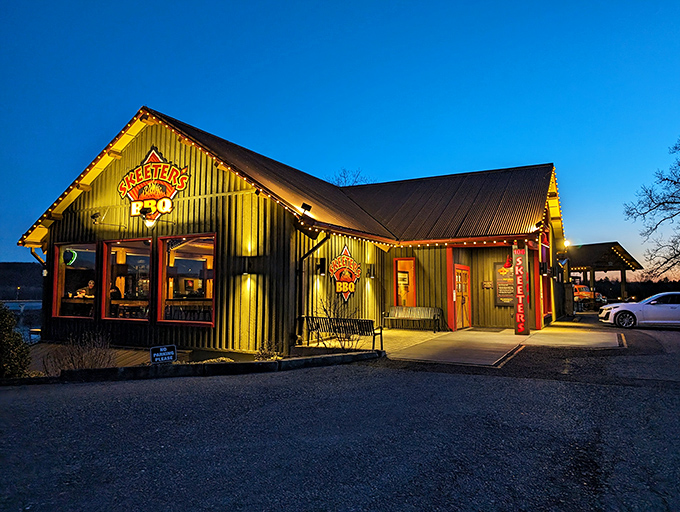 Skeeter's green exterior glows at dusk like a barbecue beacon, calling hungry travelers home with its rustic charm and promise of smoky delights.