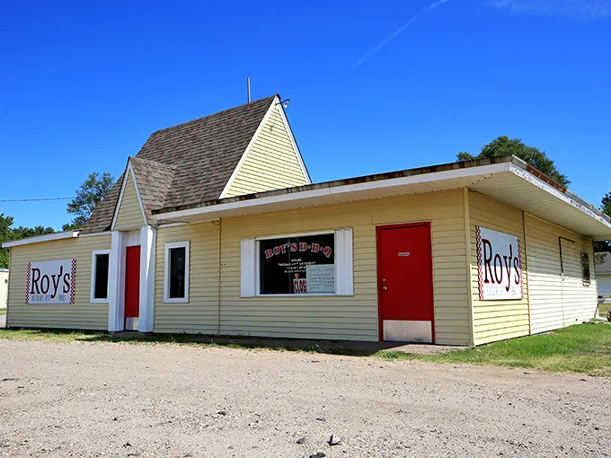 The unassuming yellow building with its bright red door stands like a beacon of barbecue hope on Hutchinson's West 4th Avenue.