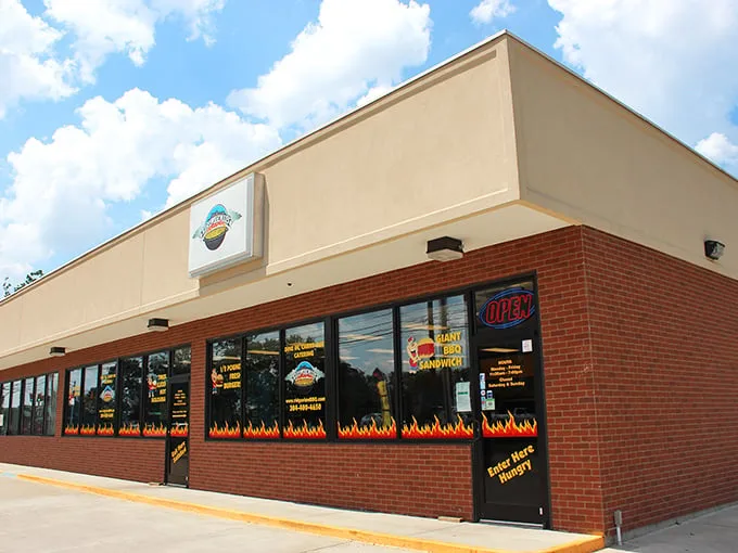 The unassuming storefront with its flame-decorated windows is like a beacon to barbecue pilgrims. Smoke signals that say "come hungry, leave happy."