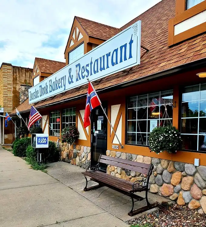The storybook exterior of Norske Nook beckons like a Norwegian fairytale, complete with stone foundation and flags that say "come hungry, leave happy."