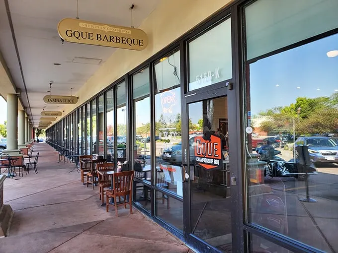 GQue's unassuming storefront hides barbecue greatness like a superhero's secret identity. The real magic happens behind those glass doors.