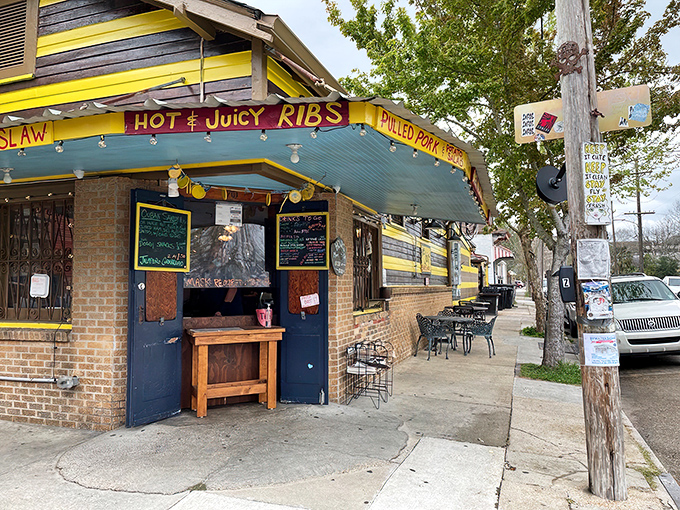 The unmistakable yellow and black striped exterior of The Joint beckons like a barbecue lighthouse in New Orleans' Bywater neighborhood.