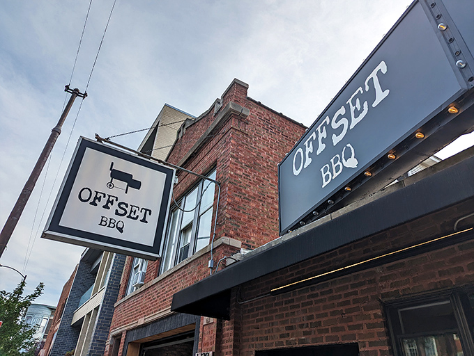 The glowing Offset BBQ sign beckons like a lighthouse for the hungry—Chicago's barbecue beacon against the twilight sky. 