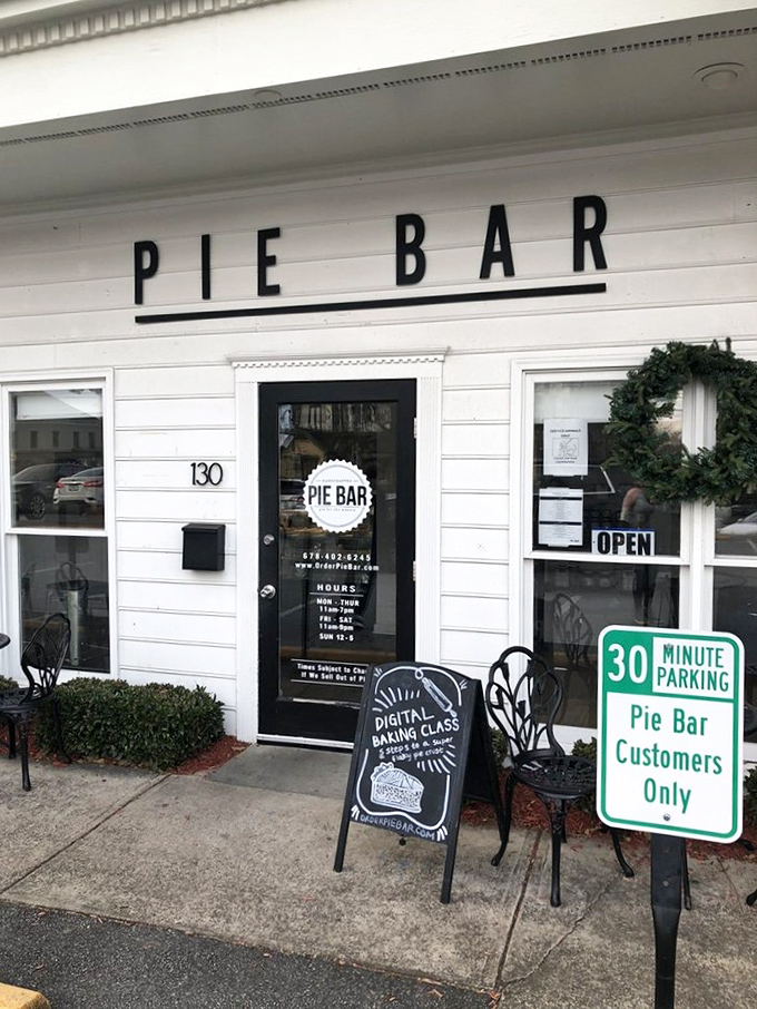 The simple white facade of Pie Bar beckons like a whisper among Woodstock's historic buildings – pie paradise awaits inside.