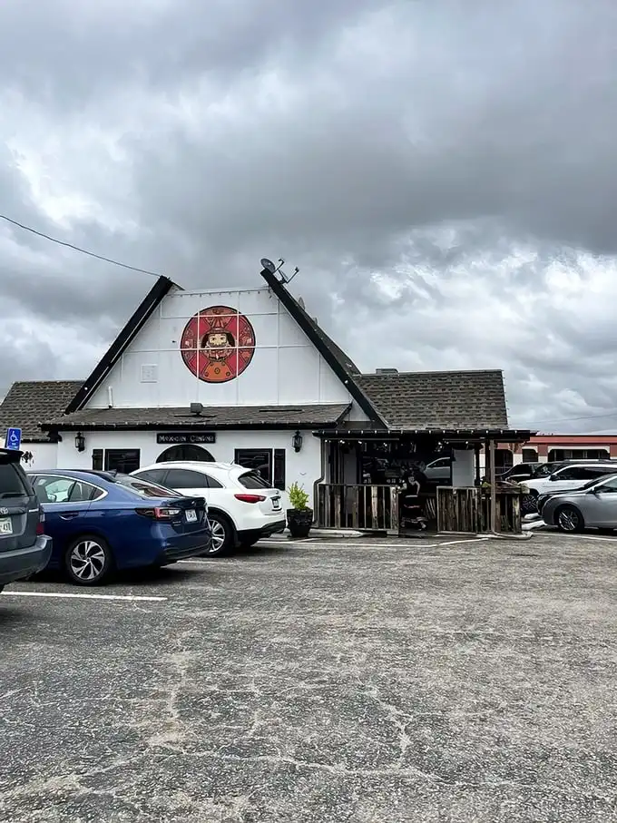 The charming A-frame exterior with its welcoming red umbrellas feels like discovering a secret portal to Mexico right in Oklahoma City.