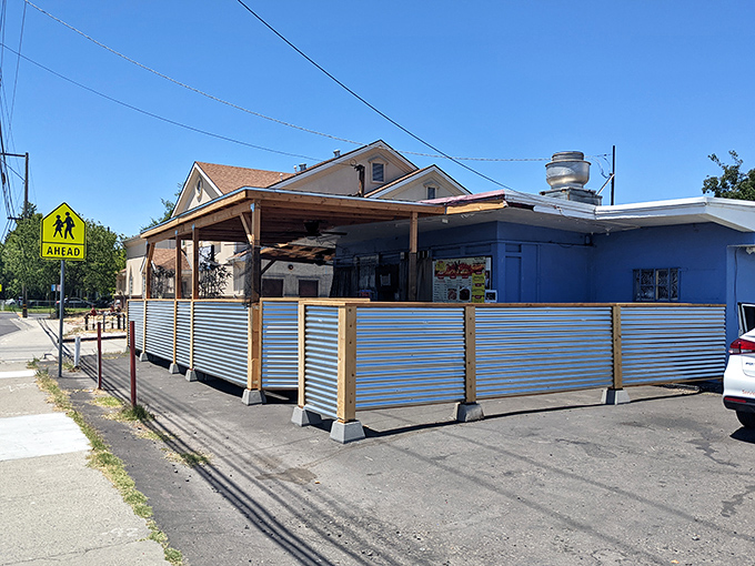 The unassuming blue exterior of Tori's Place stands like a culinary speakeasy – no fancy frills, just the promise of soul-satisfying greatness within.