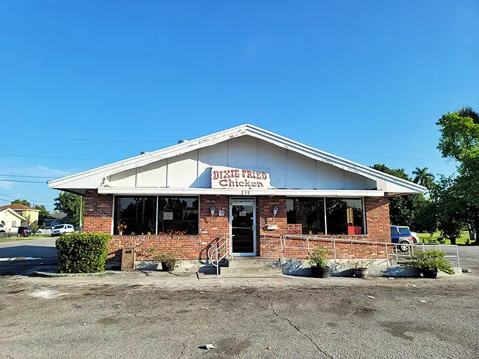 The unassuming brick exterior of Dixie Fried Chicken stands like a culinary lighthouse in Belle Glade, promising comfort food salvation to those in the know.