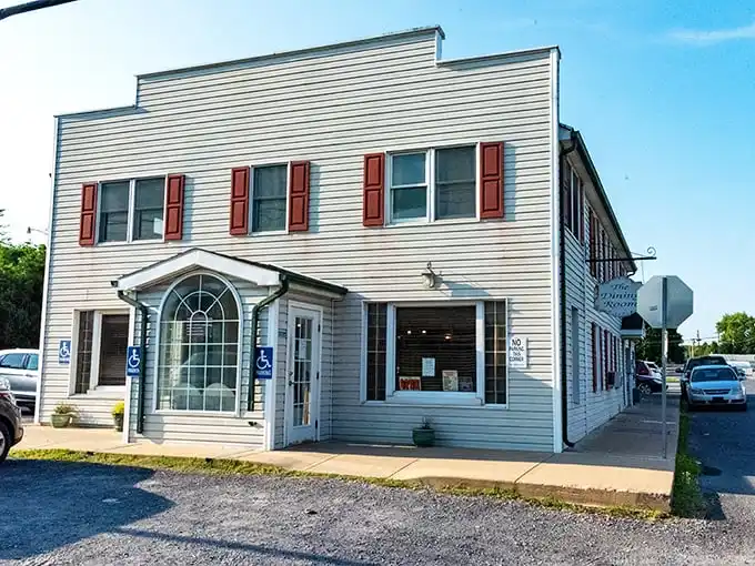 The unassuming exterior of The Dining Room Restaurant in Romney stands like a culinary speakeasy – hiding treasures that locals have kept secret for generations.