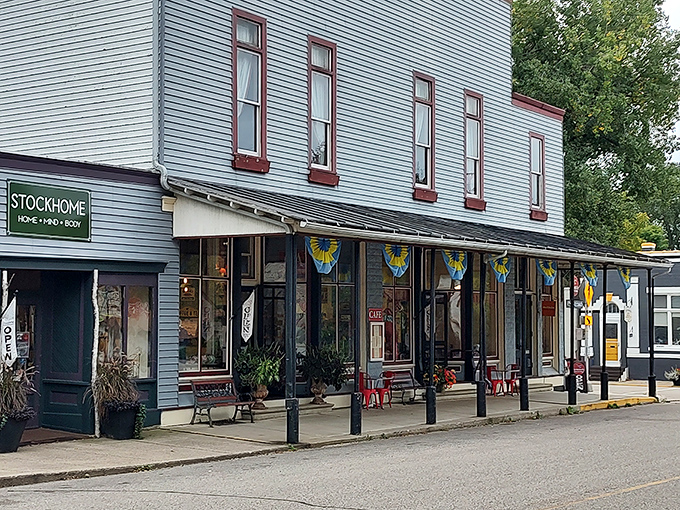This isn't just a storefront—it's a siren call to pie lovers everywhere. The classic white clapboard with cheery yellow bunting practically whispers, "Come inside, calories don't count in Stockholm."