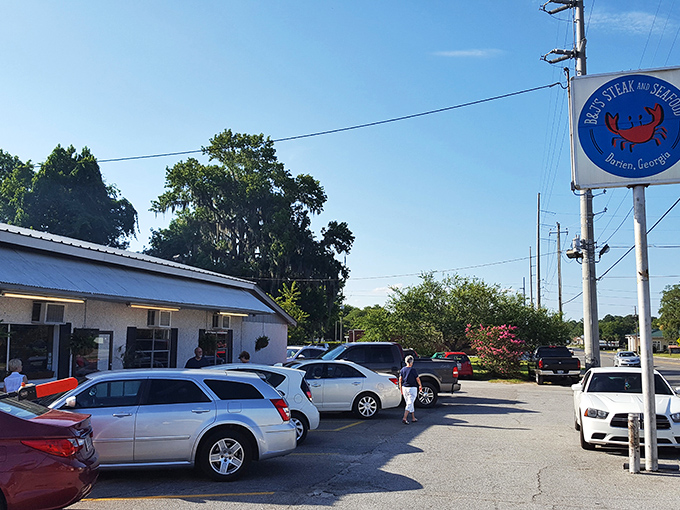 The unassuming exterior of B&J's Steaks & Seafood proudly announces "FRESH SHRIMP" in bold red letters—a coastal Georgia promise that's gloriously kept inside.